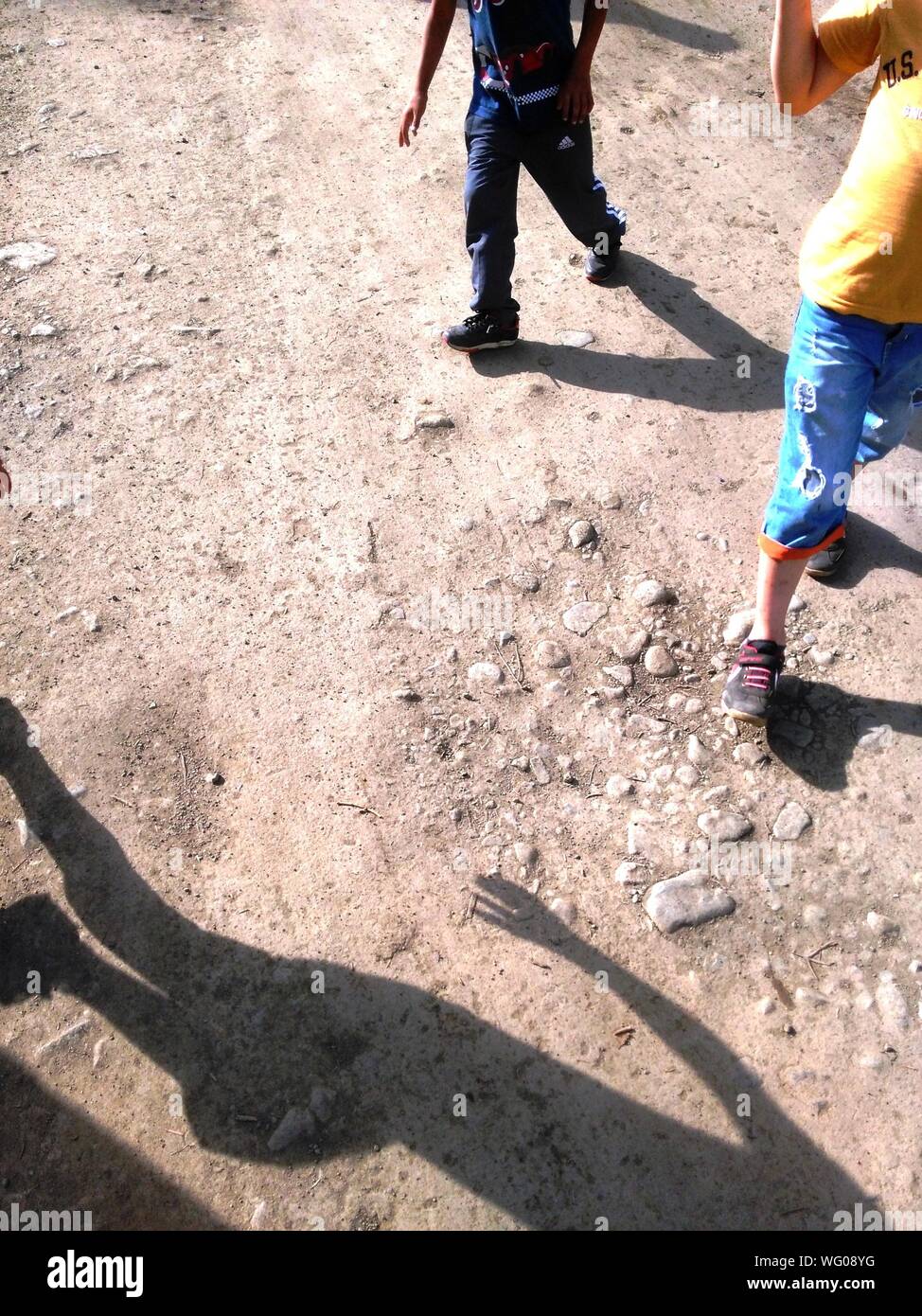 Children on ground hi-res stock photography and images - Alamy