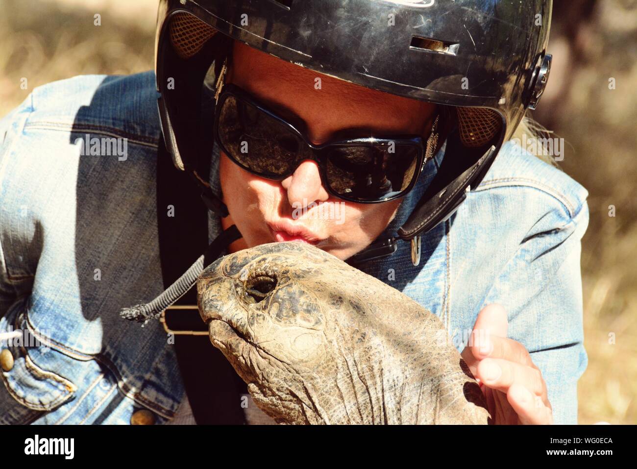 Woman and tortoise hi-res stock photography and images - Alamy