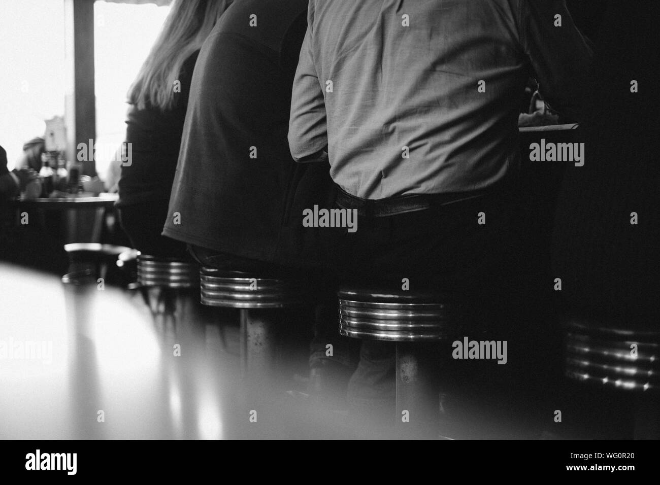 Sitting On Bar Stool High Resolution Stock Photography and Images - Alamy