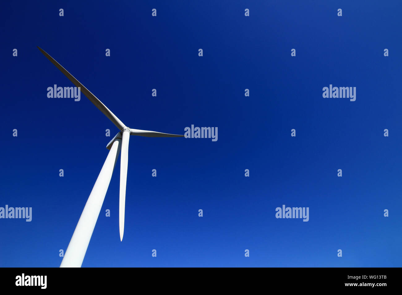 Propeller of wind power generation facility under blue sky Stock Photo ...