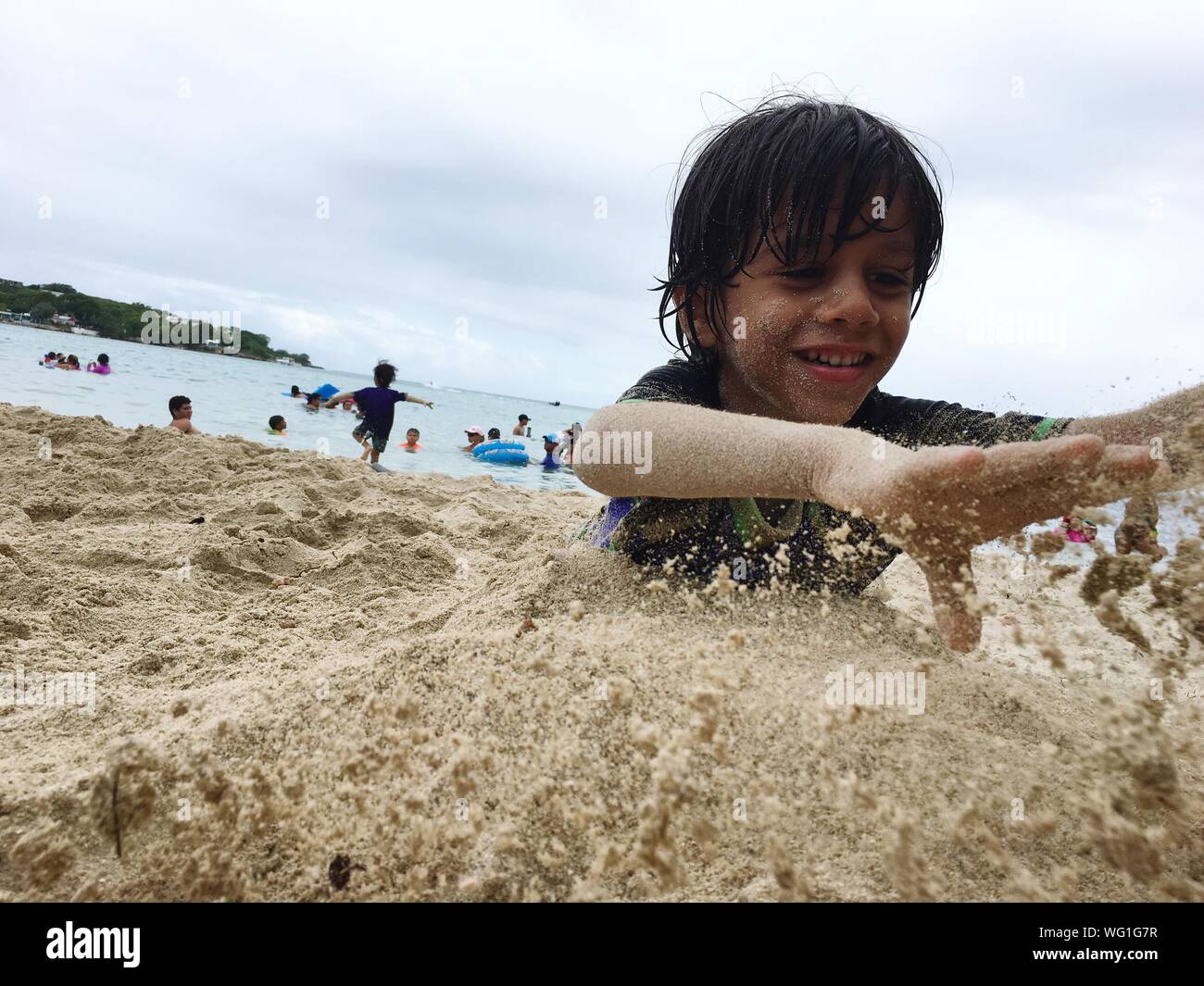 People buried in sand hi-res stock photography and images - Alamy