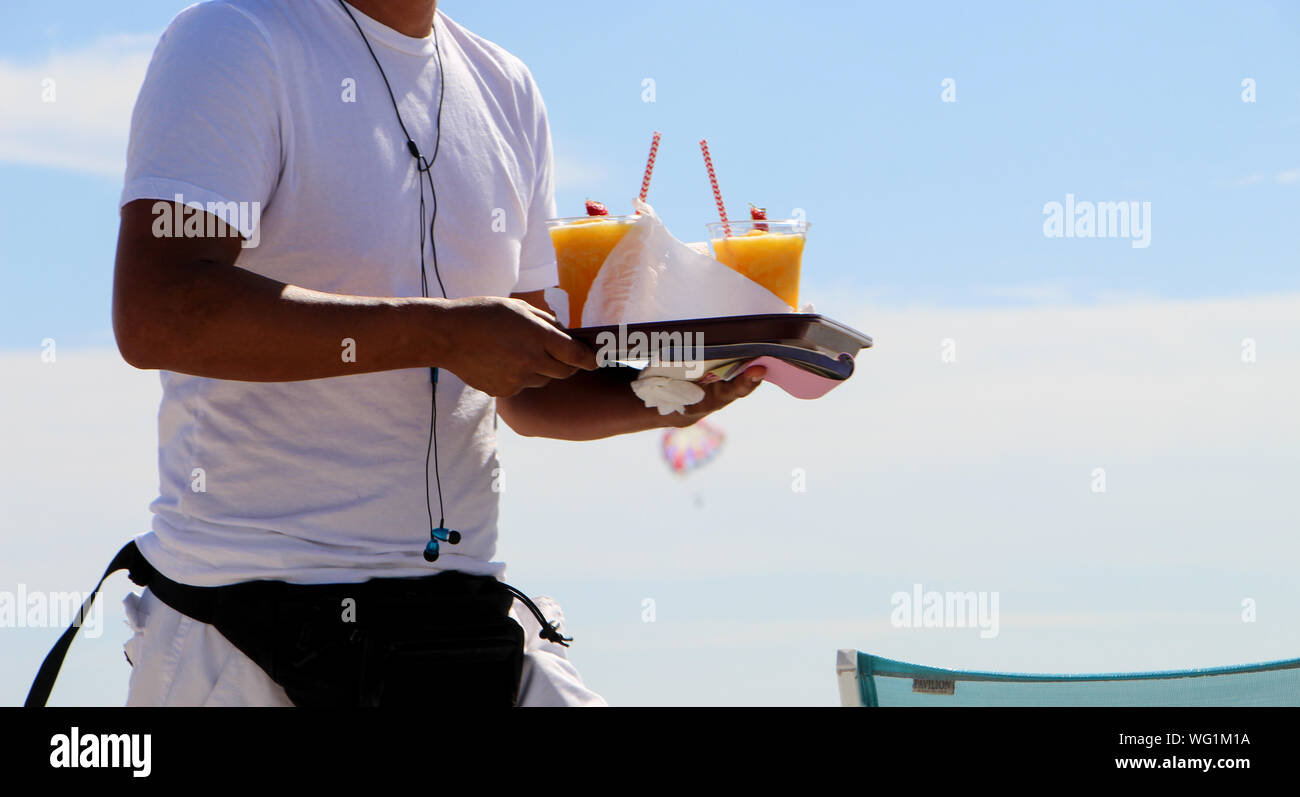 Waiter carrying tray hi-res stock photography and images - Alamy