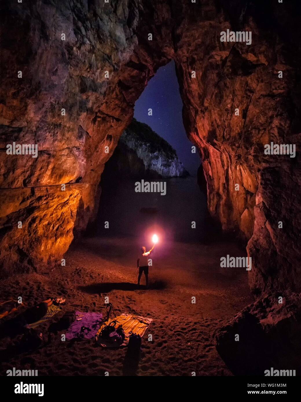 Man torch cave hi-res stock photography and images - Alamy