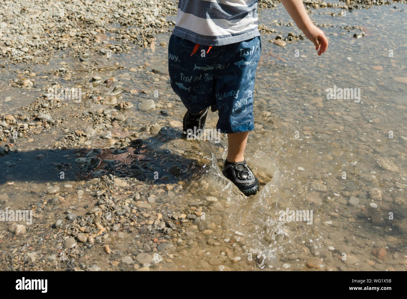 Boy puddle splashing hi-res stock photography and images - Alamy