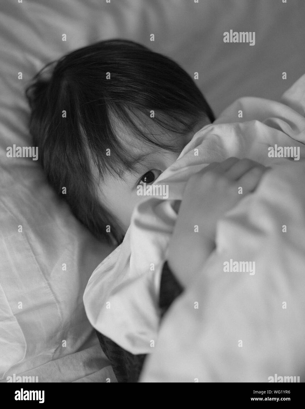 Child get in to bed Black and White Stock Photos & Images - Alamy