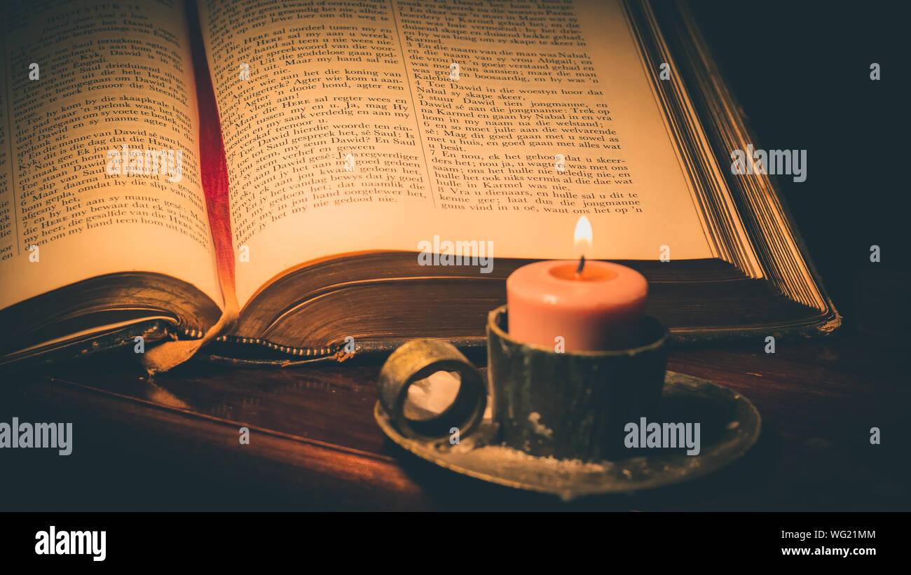 Open Bible Candle High Resolution Stock Photography and Images - Alamy
