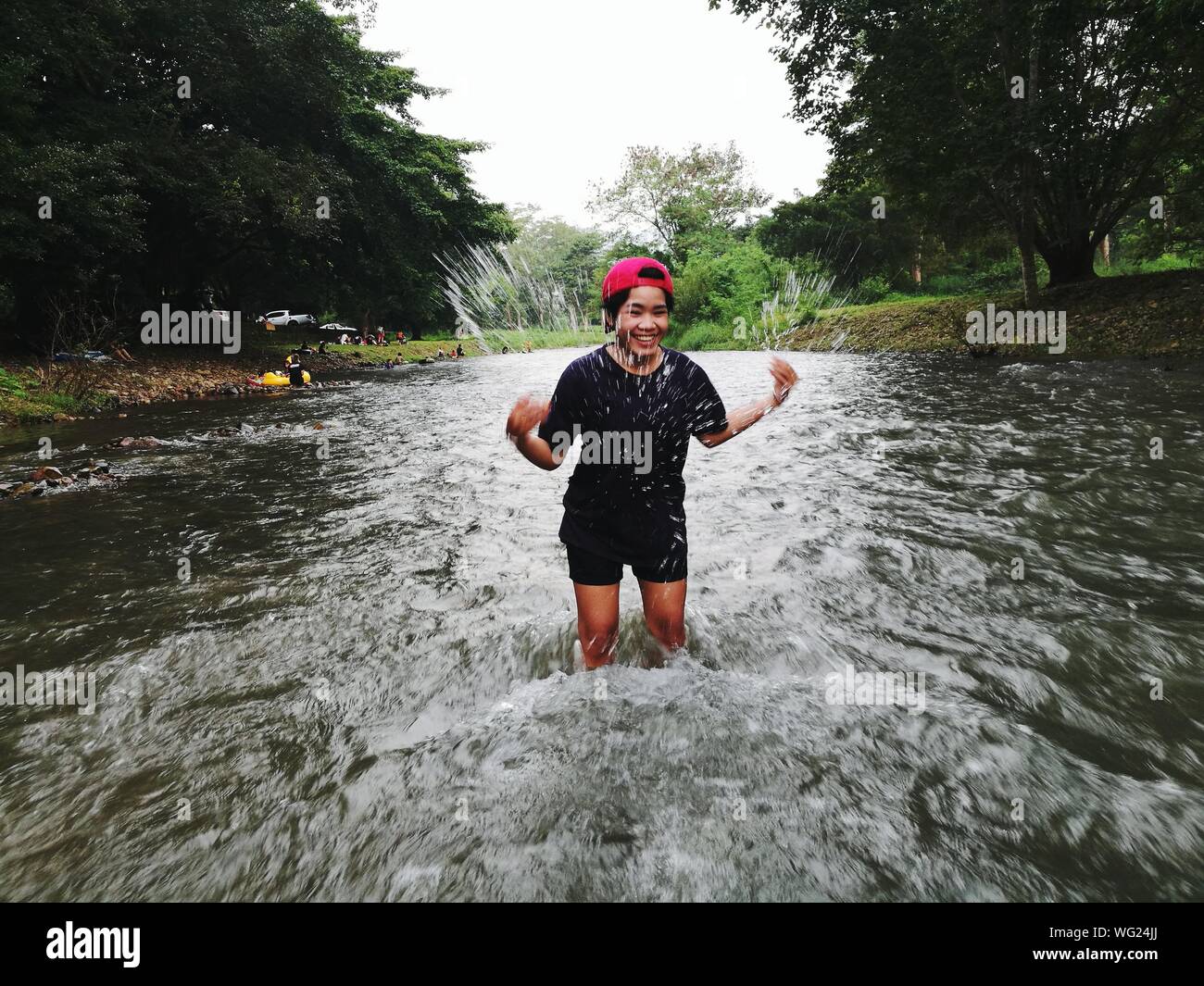 Woman splashing about in river hi-res stock photography and images - Alamy