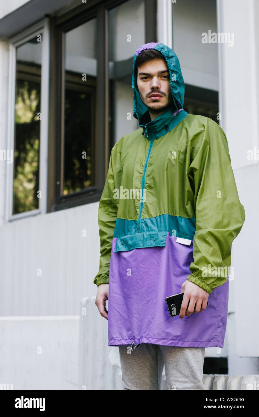 Man with raincoat hi-res stock photography and images - Alamy