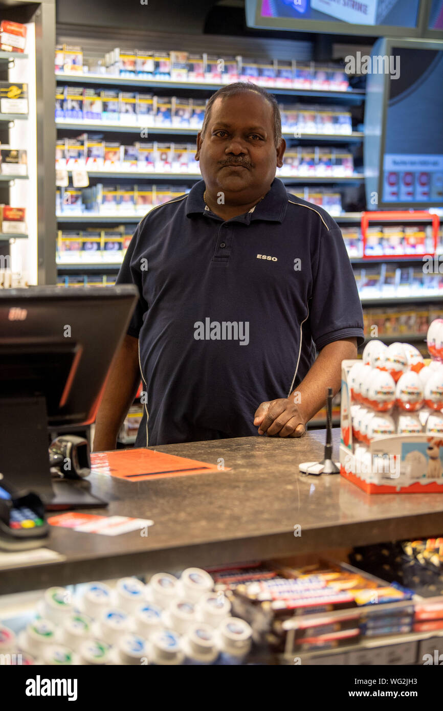 Augsburg, Germany. 26th Aug, 2019. Sugendran Veluppillai, cashier, is ...