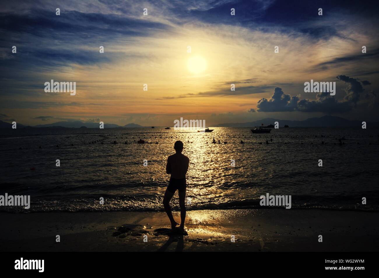 Man Watching Sunset At The Beach High Resolution Stock Photography and ...