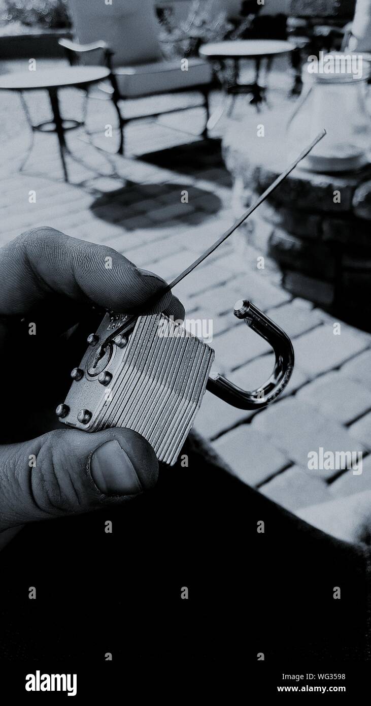 Hand and lock hi-res stock photography and images - Alamy