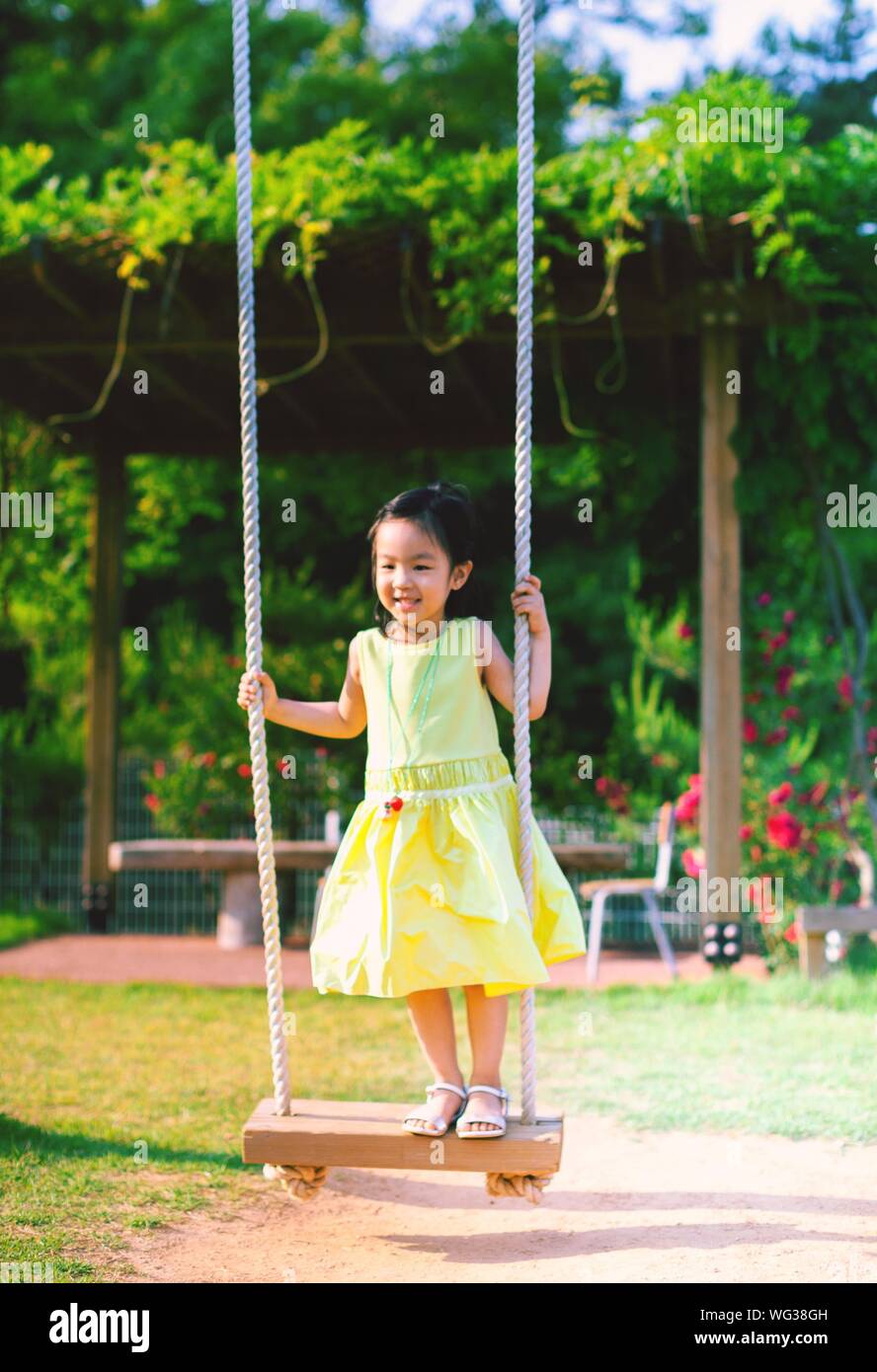 Girl On Swing Rope High Resolution Stock Photography and Images - Alamy