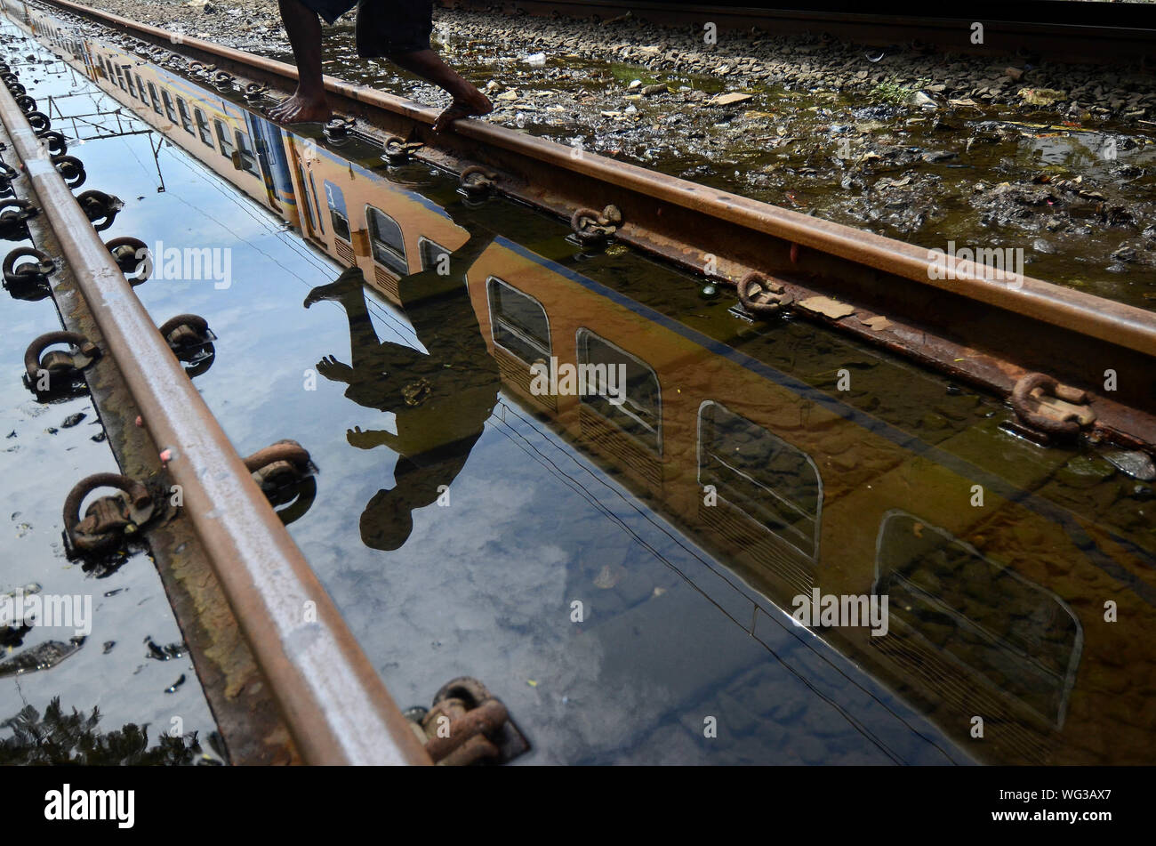 Man jumping puddle hi-res stock photography and images - Alamy