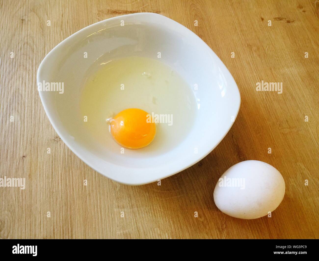 Wooden table and egg hi-res stock photography and images - Alamy