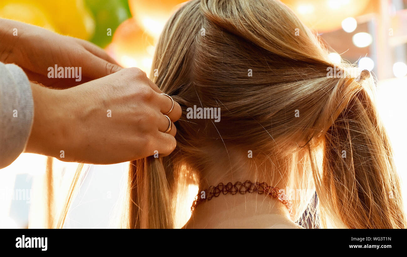 Girl styling her hair hi-res stock photography and images - Alamy