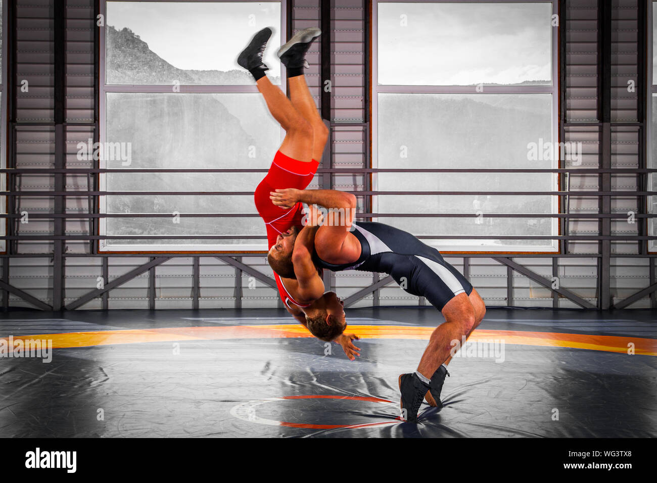 The concept of fair wrestling. Two greco-roman wrestlers in red and ...