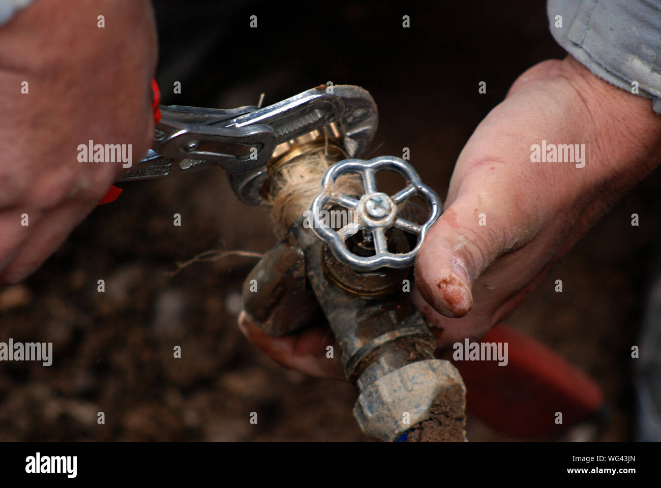 Hands holding pipe hi-res stock photography and images - Alamy