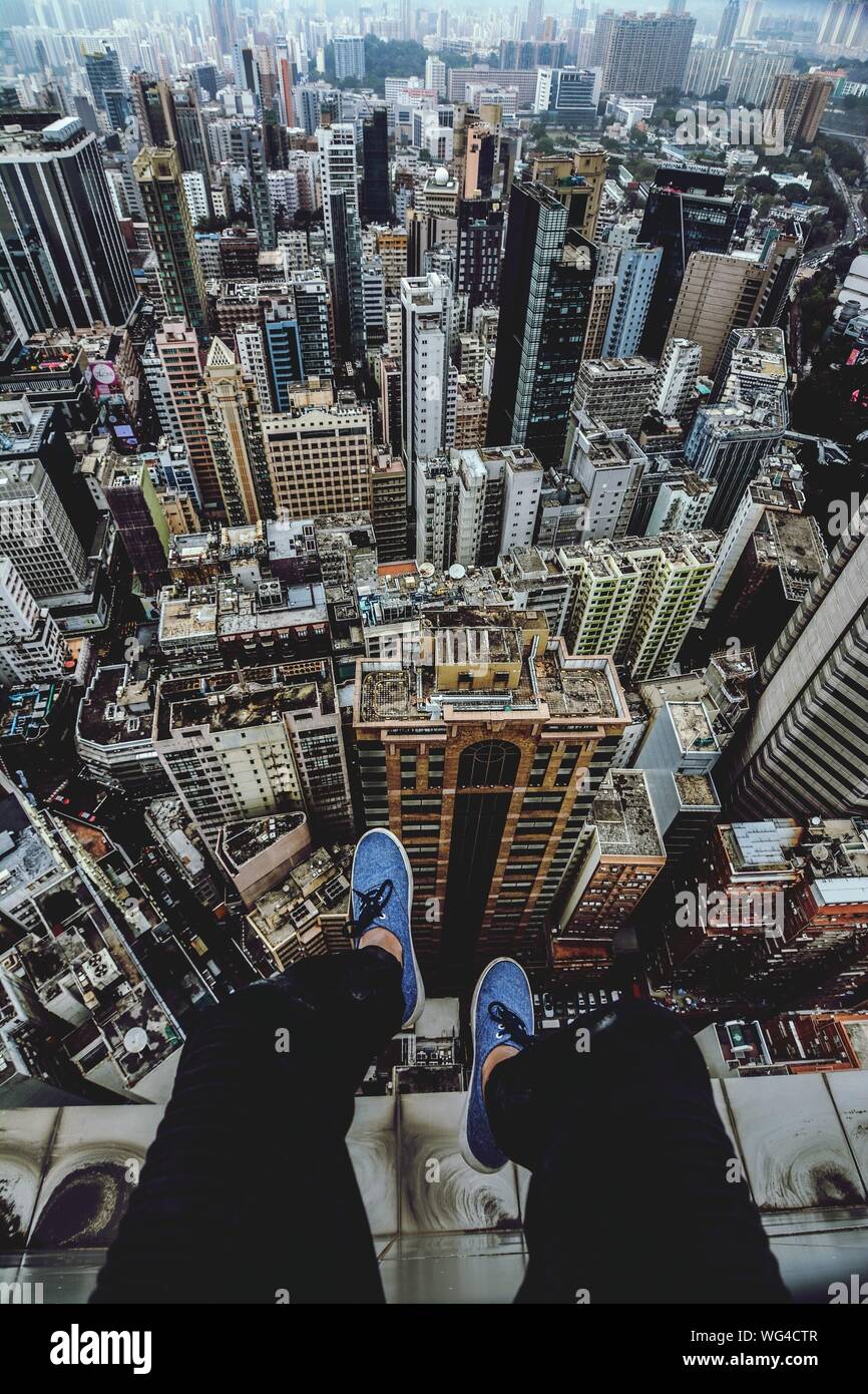 Man sitting on rooftop hi-res stock photography and images - Alamy