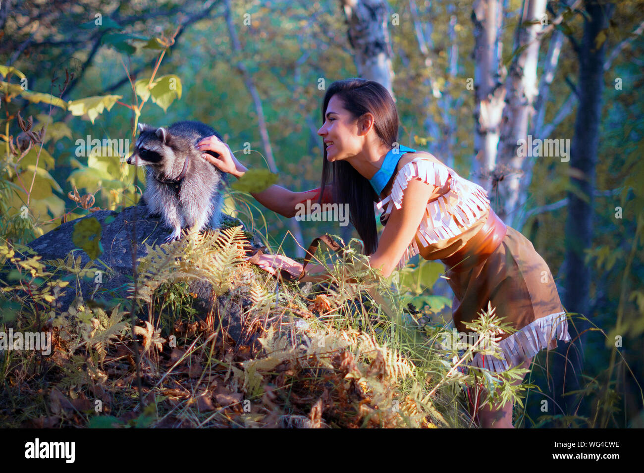 Woman holding raccoon hi-res stock photography and images - Alamy