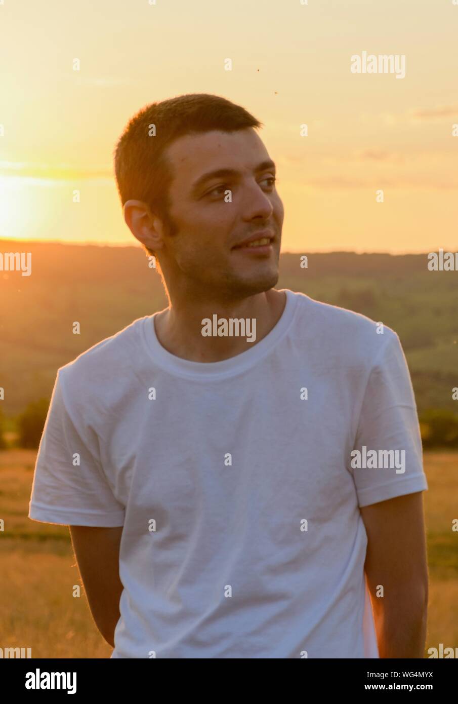 Man smiling sunset hi-res stock photography and images - Alamy