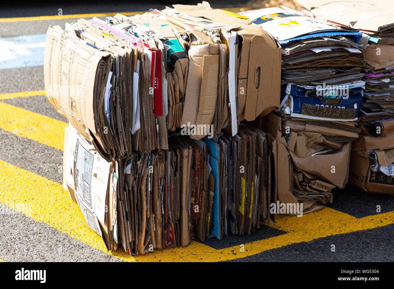 Cardboard stacked carefully in designated collection zone Stock Photo ...