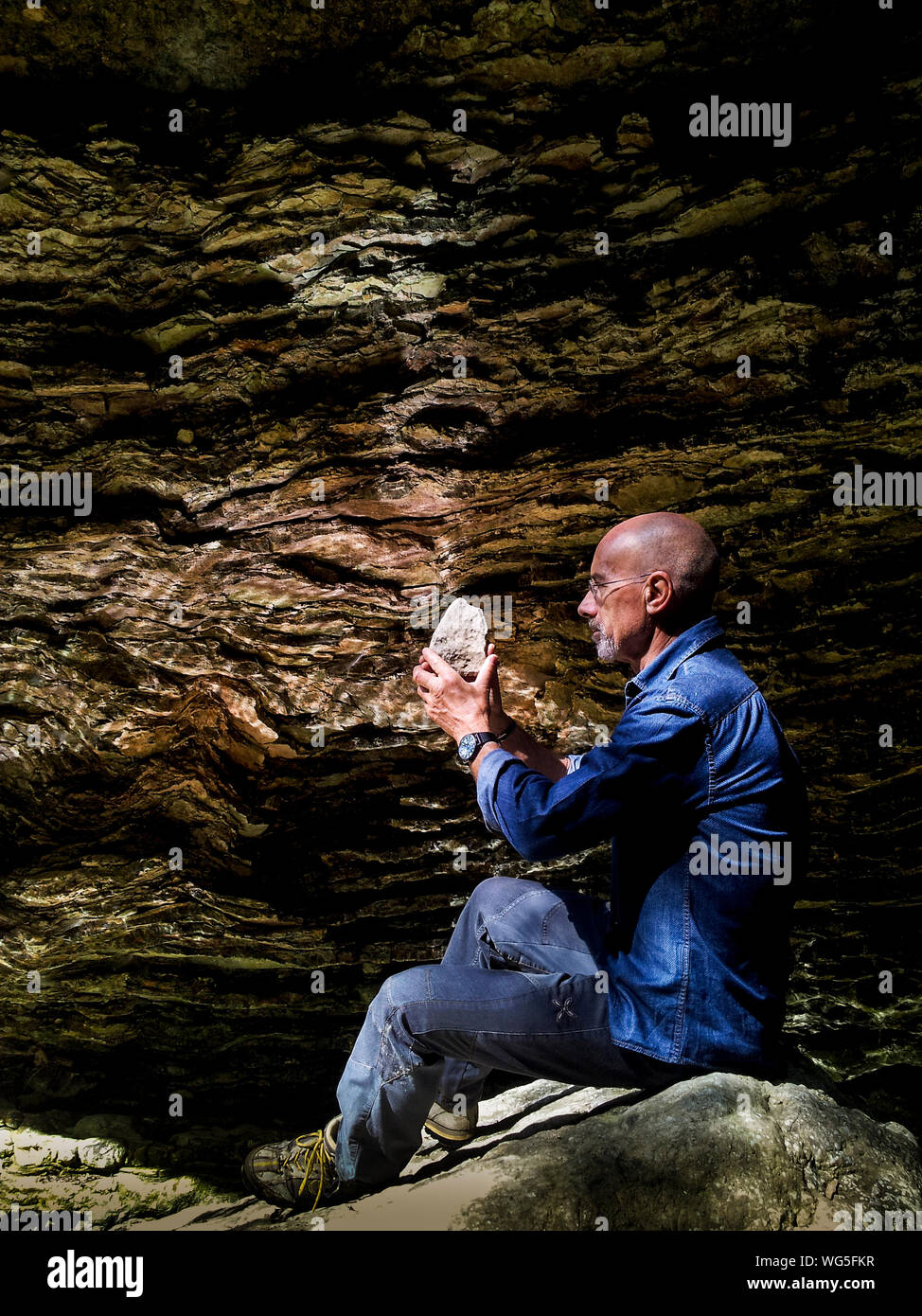 Man holding the stone hi-res stock photography and images - Alamy