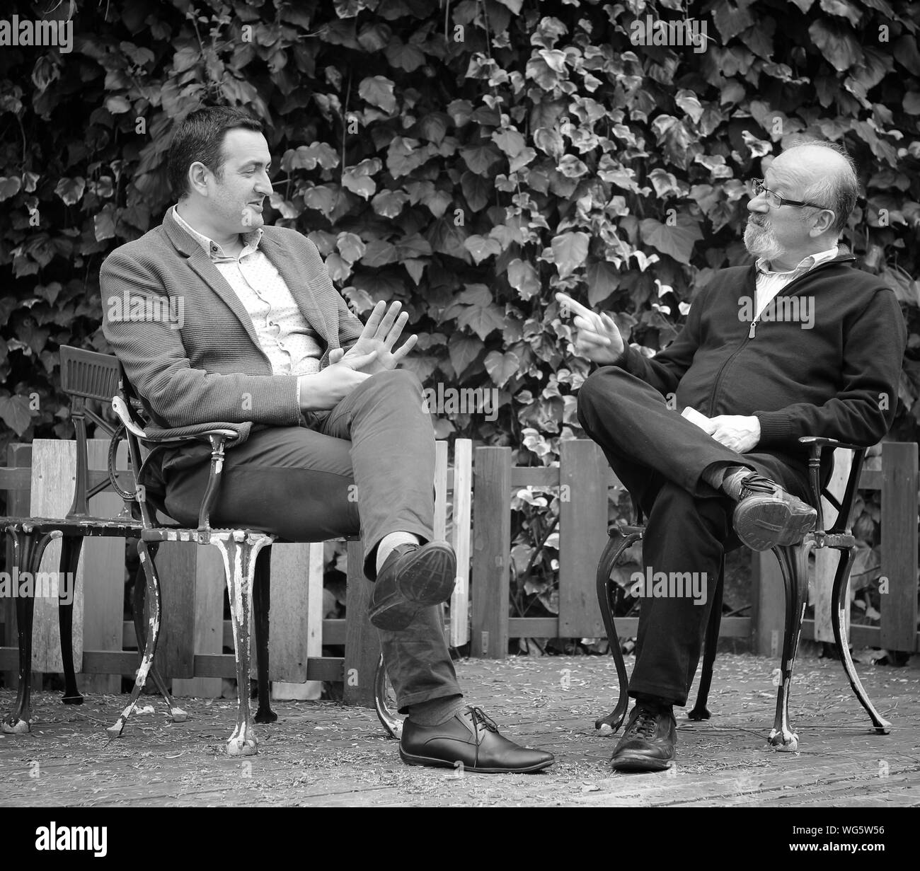 Two old men talking in park hi-res stock photography and images - Alamy