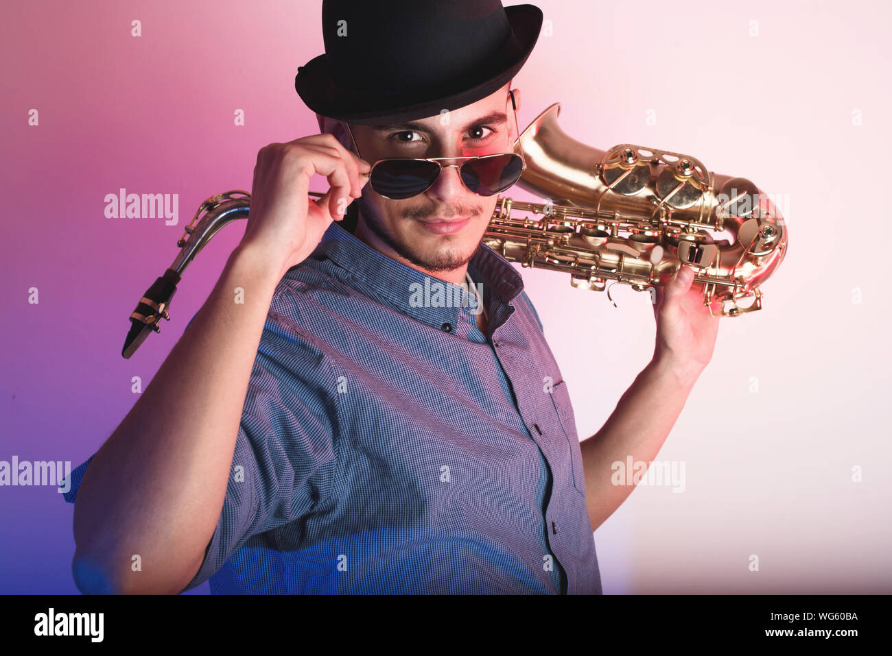 Man Holding Saxophone High Resolution Stock Photography and Images - Alamy