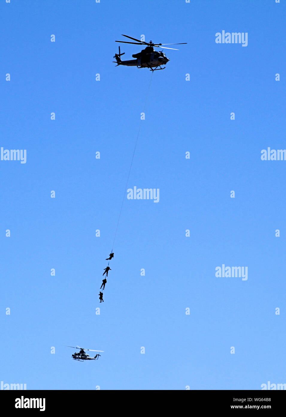 Helicopter Hanging From Helicopter High Resolution Stock Photography ...