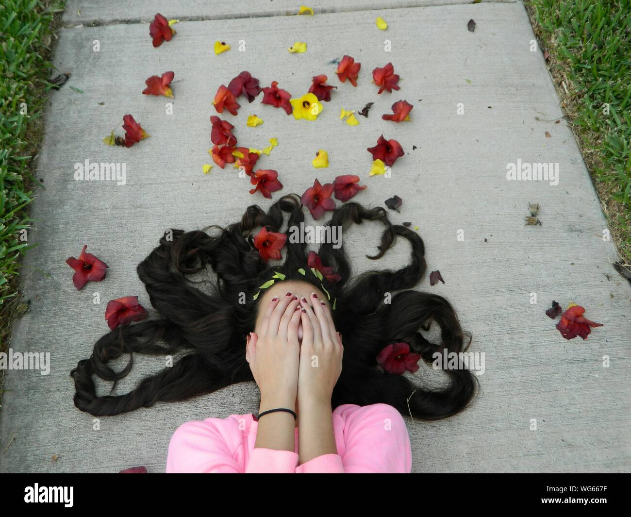 Hiding hands hi-res stock photography and images - Alamy