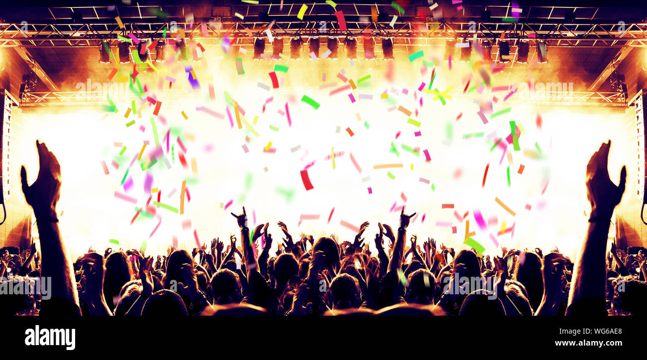 Concert hall crowded with clapping people Stock Photo - Alamy