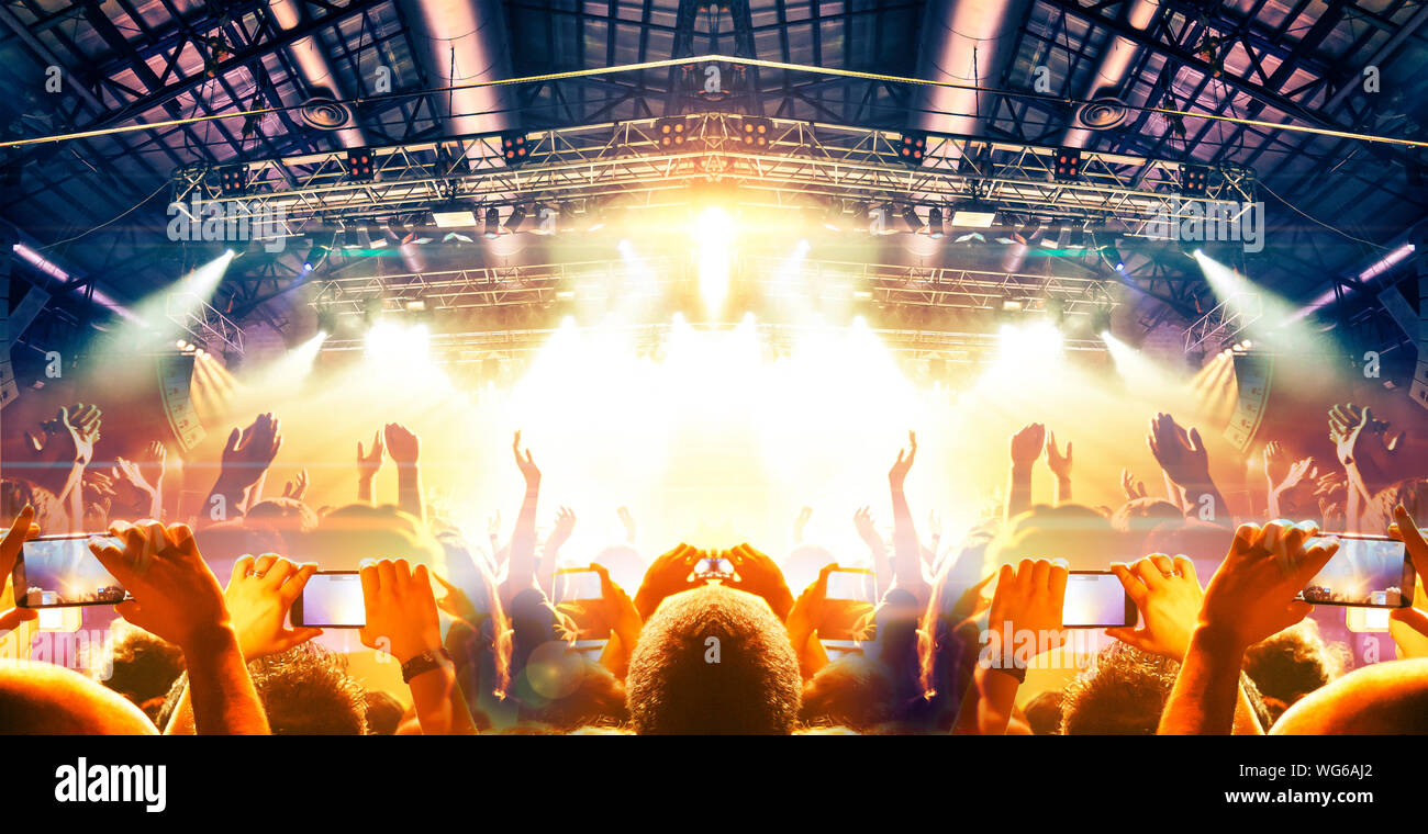 Concert hall crowded with clapping people Stock Photo - Alamy