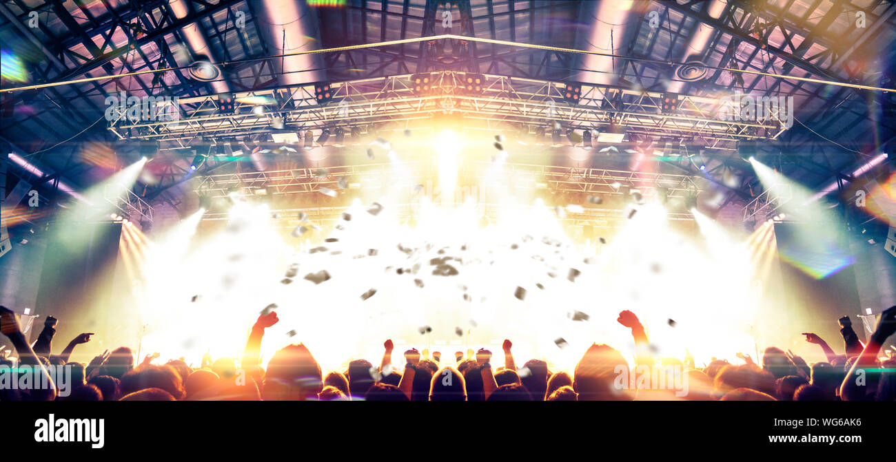 Concert hall crowded with clapping people Stock Photo - Alamy