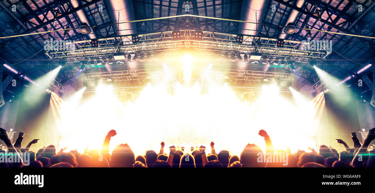 Concert hall crowded with clapping people Stock Photo - Alamy