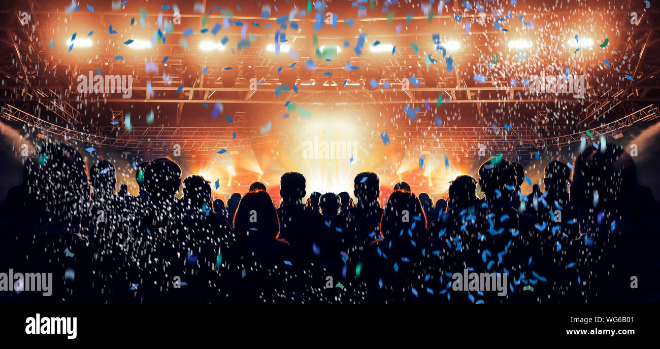 Concert hall crowded with clapping people Stock Photo - Alamy