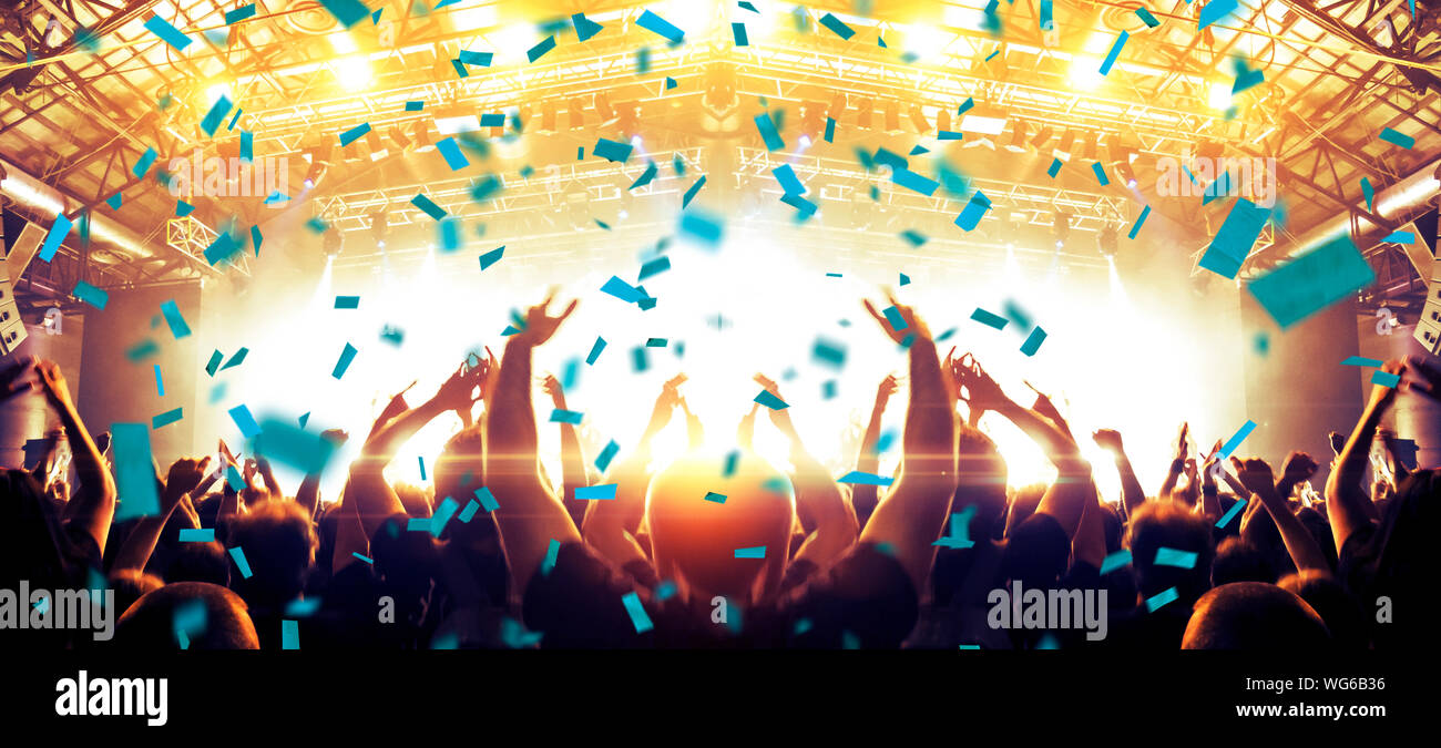 Concert hall crowded with clapping people Stock Photo - Alamy