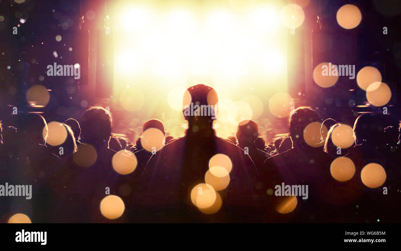 Concert hall crowded with clapping people Stock Photo - Alamy