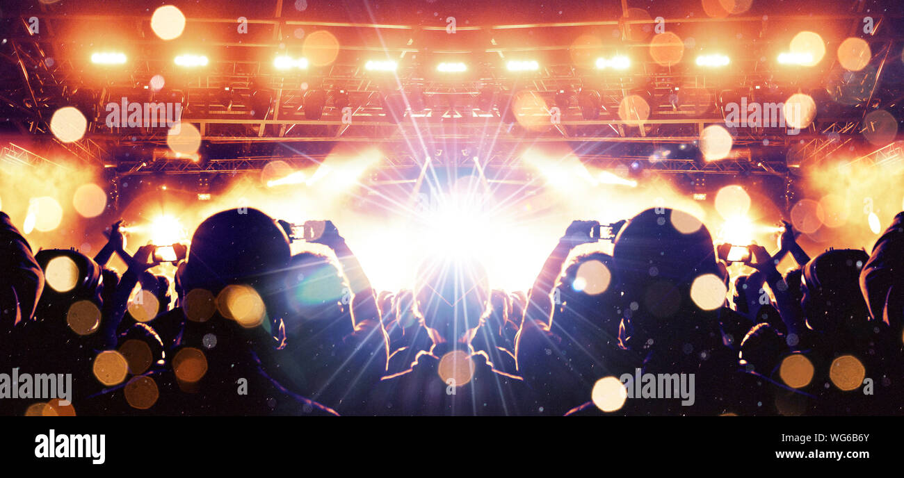 Concert hall crowded with clapping people Stock Photo - Alamy