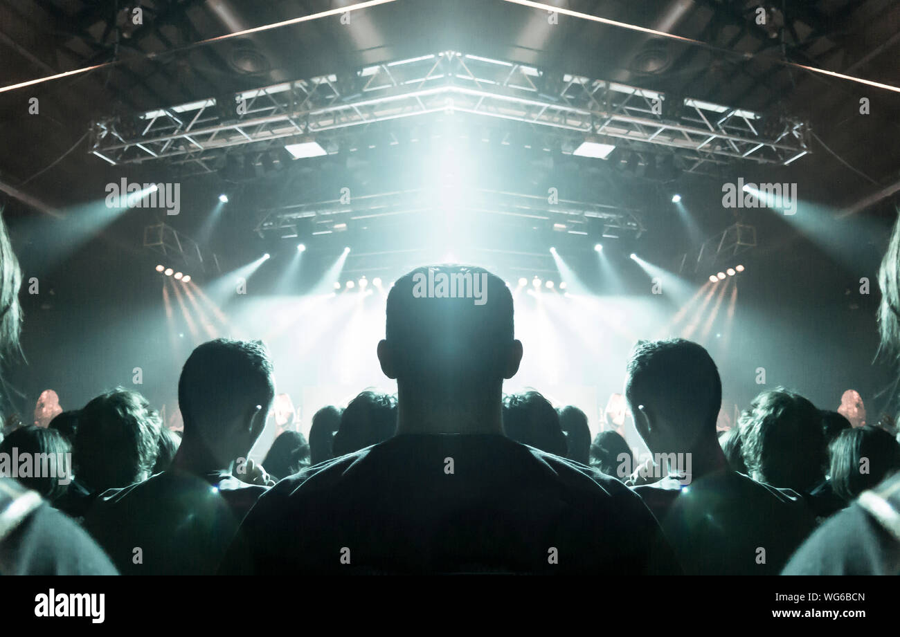 Concert hall crowded with clapping people Stock Photo - Alamy