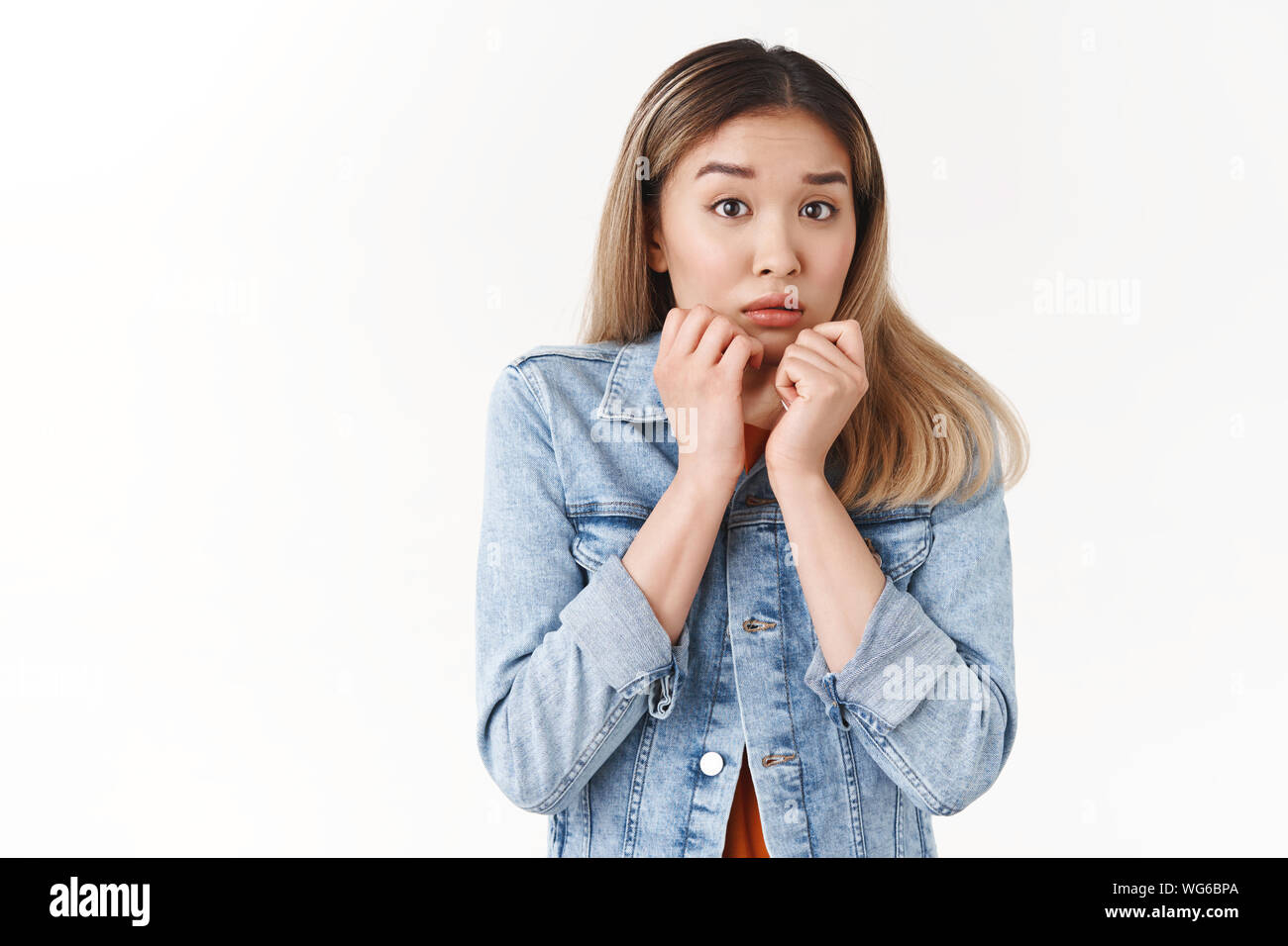 Silly insecure timid asian blond girl feel unsafe scared shivering fear ...