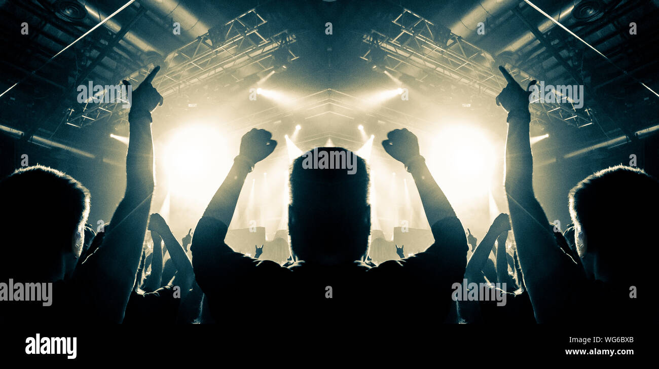 Concert hall crowded with clapping people Stock Photo - Alamy