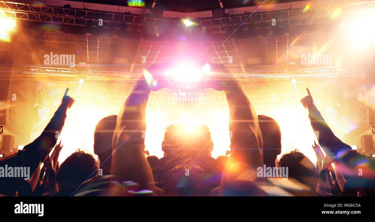 Concert hall crowded with clapping people Stock Photo - Alamy