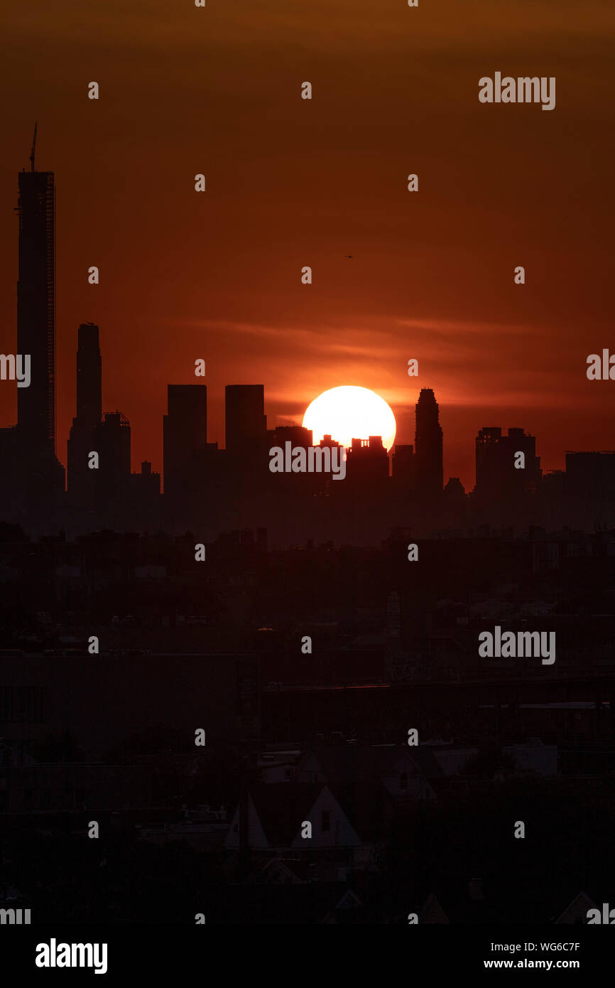 New York, USA. 30th Aug, 2019. Sunset over Manhattan is pictured from ...