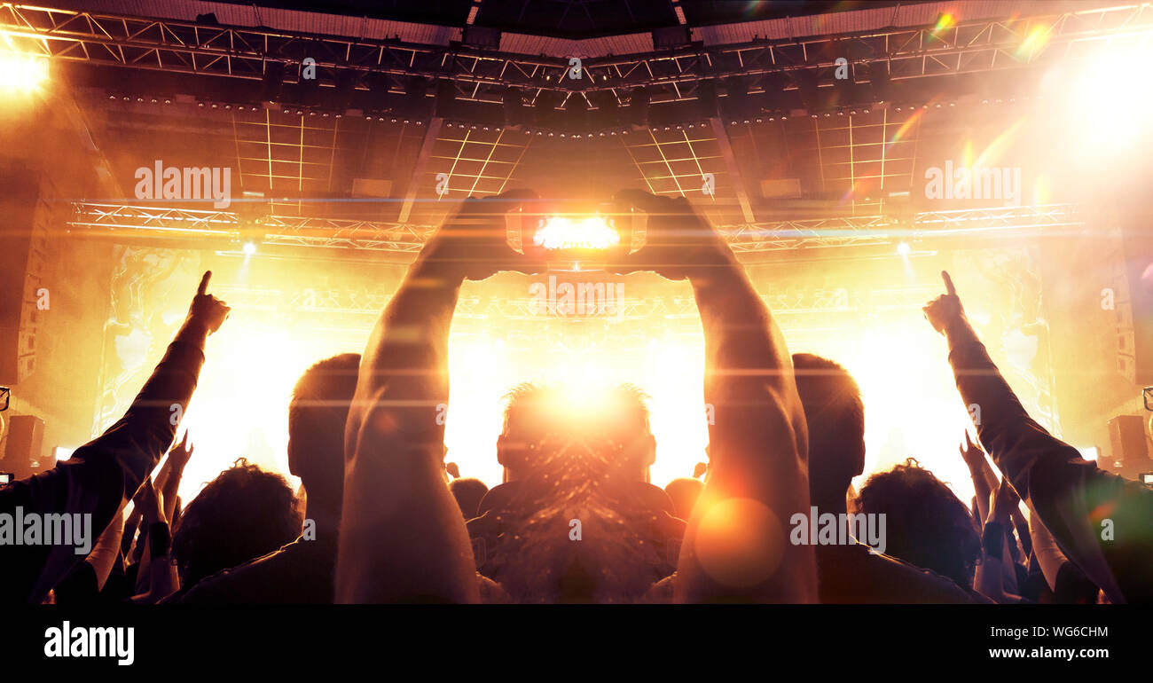 Concert hall crowded with clapping people Stock Photo - Alamy