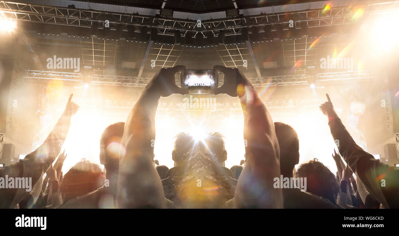 Concert hall crowded with clapping people Stock Photo - Alamy