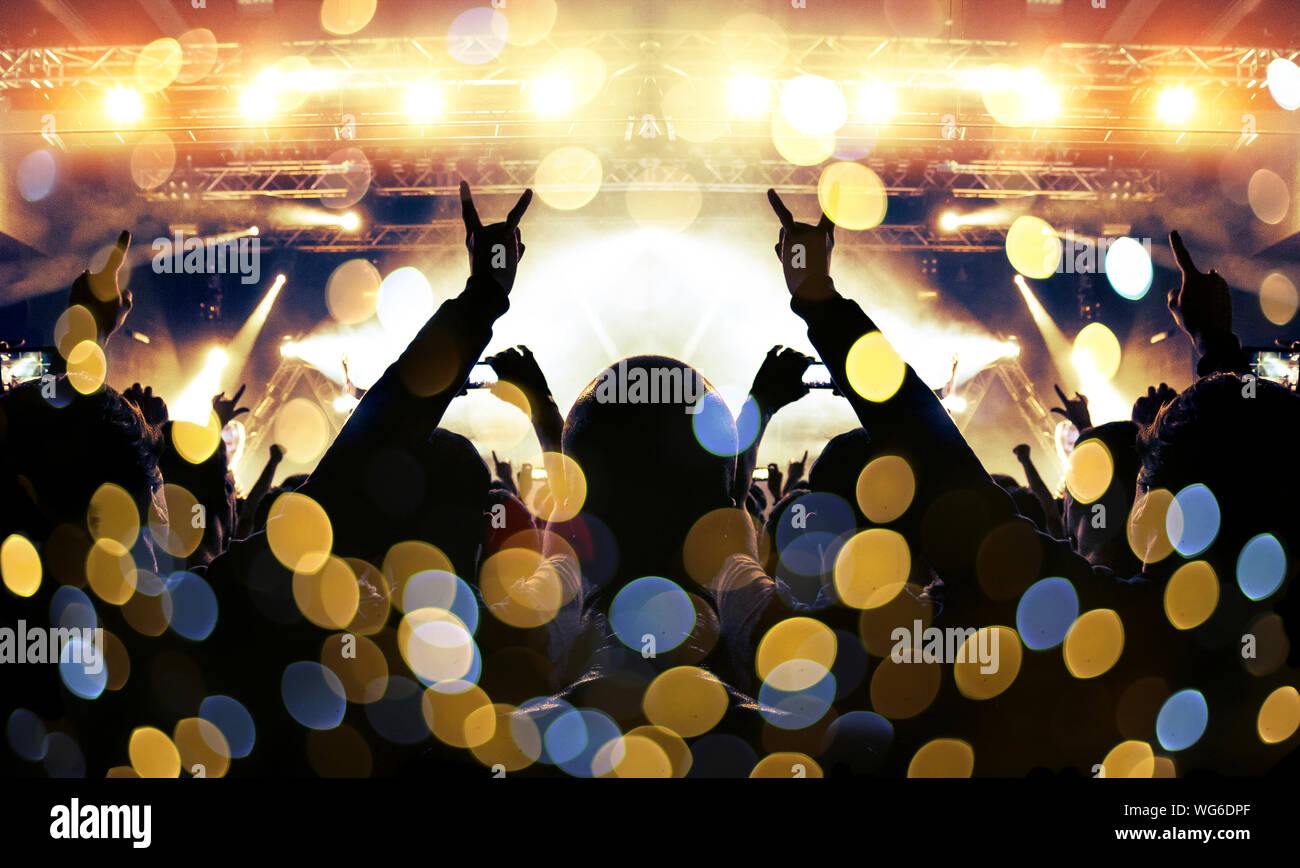 Concert hall crowded with clapping people Stock Photo - Alamy