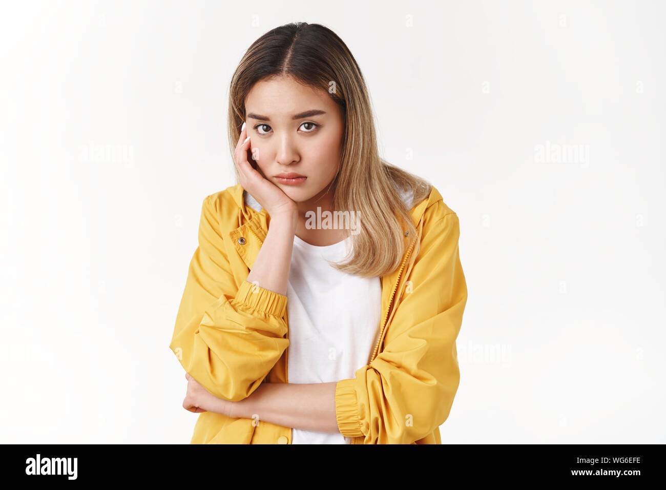 Gloomy young sad asian blond girl sighing upset stoop look from under ...