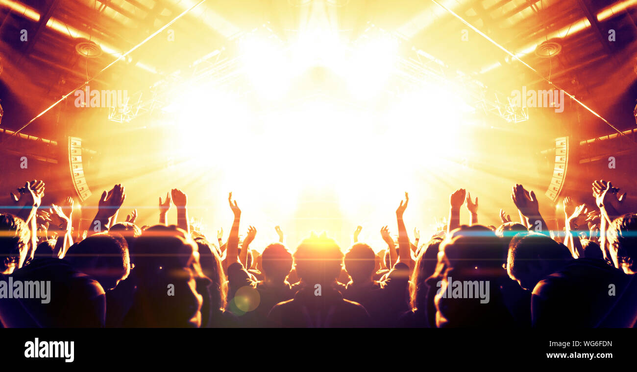 Concert hall crowded with clapping people Stock Photo - Alamy
