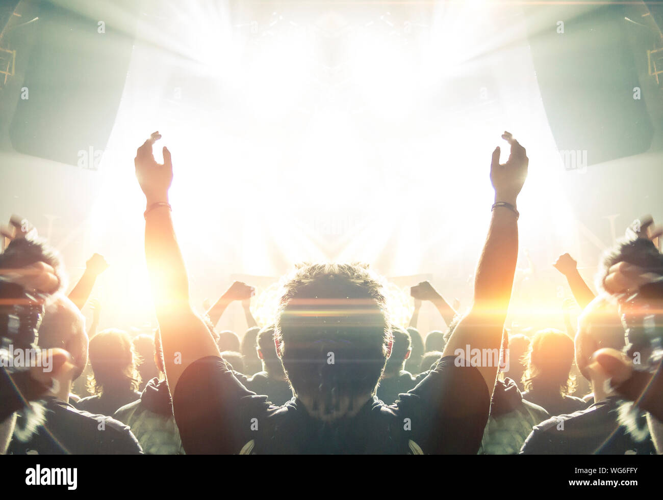 Concert hall crowded with clapping people Stock Photo - Alamy