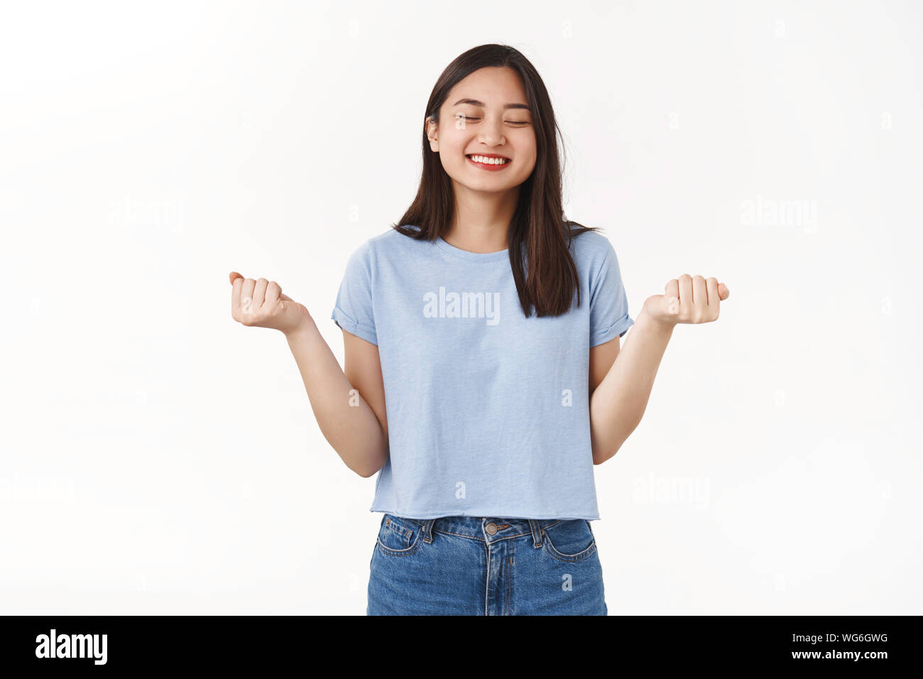 Yes girls can do anything. Confident lucky cheerful asian girl close ...